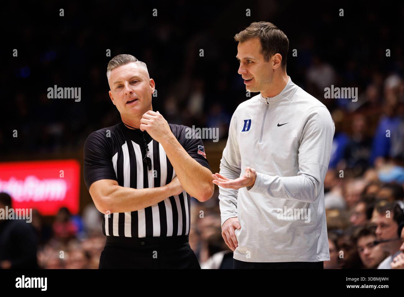 Duke head coach Jon Scheyer, right, speaks to official Justin ...