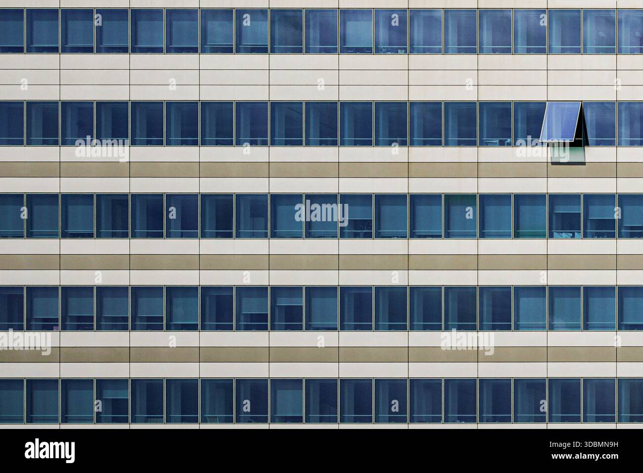 Facade with horizontal beige and white bands hi-res stock photography ...