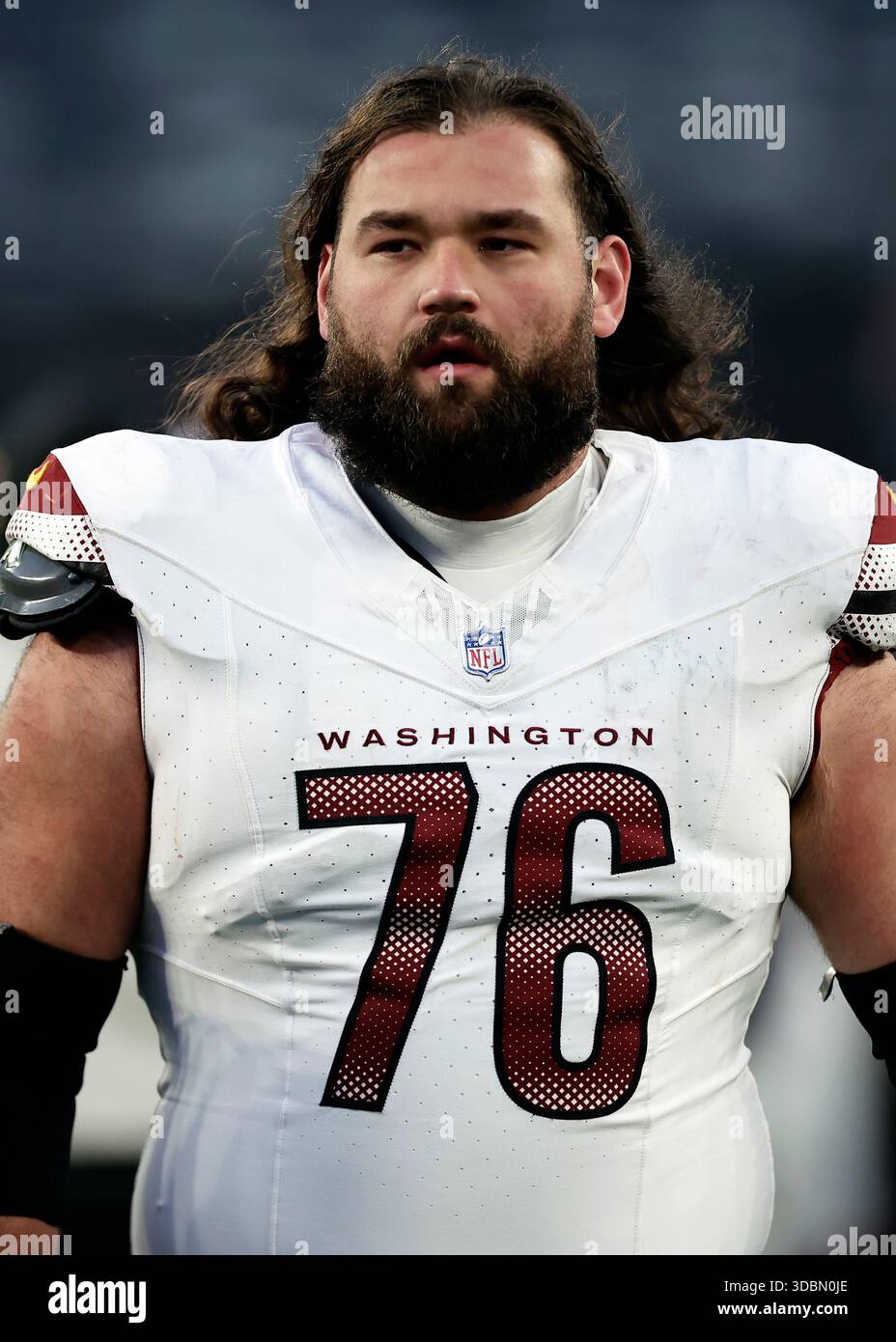 Washington Commanders guard Sam Cosmi (76) reacts after an NFL football ...