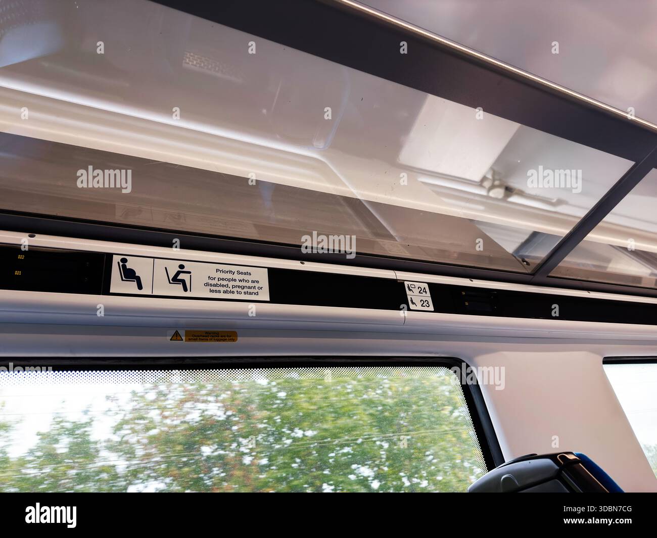 Interior of a Manchester train showing priority seating for disabled ...
