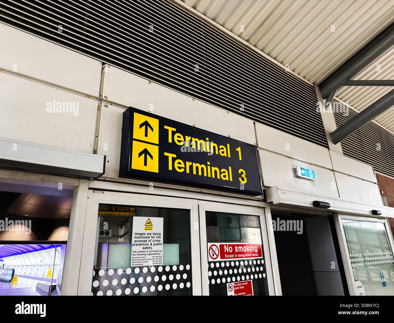 Direction signs at Manchester airport point to Terminal 1 and Terminal ...