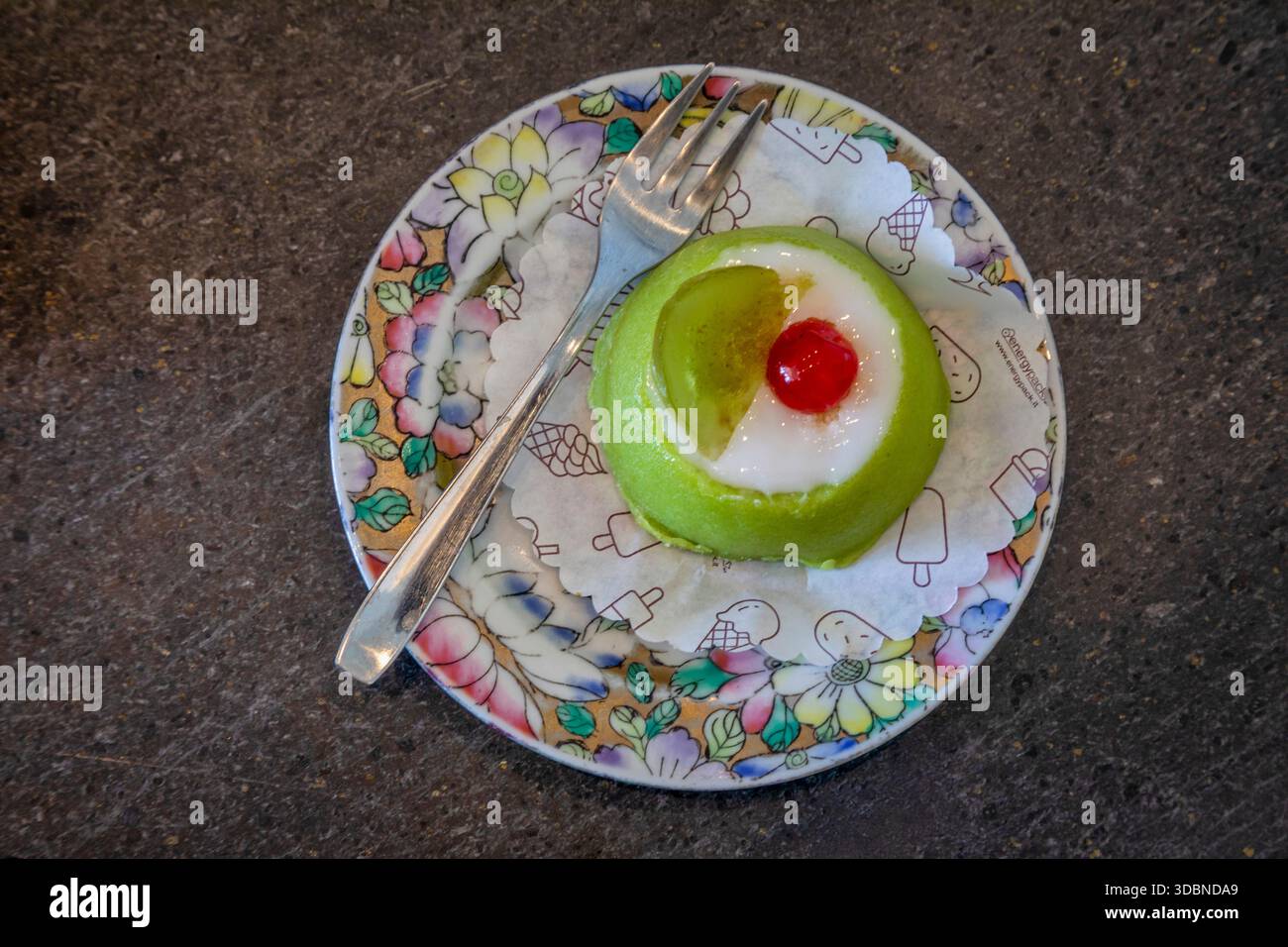 Traditional Sicilian cassata dessert served on a colorful floral plate ...