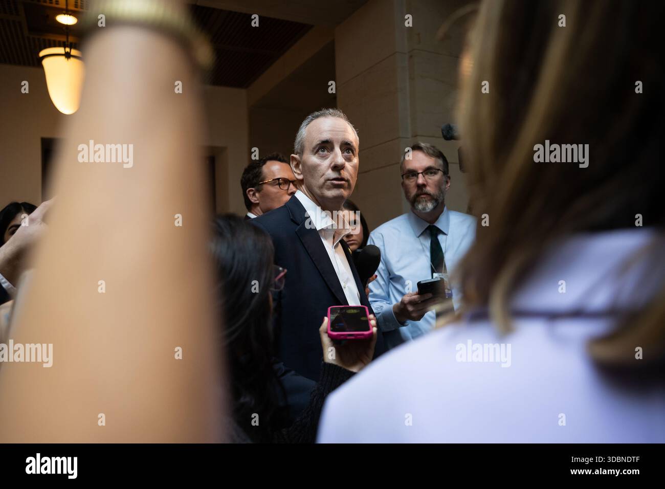 Rep. Brian Fitzpatrick (R-Pa.) speaks with reporters as he departs a ...