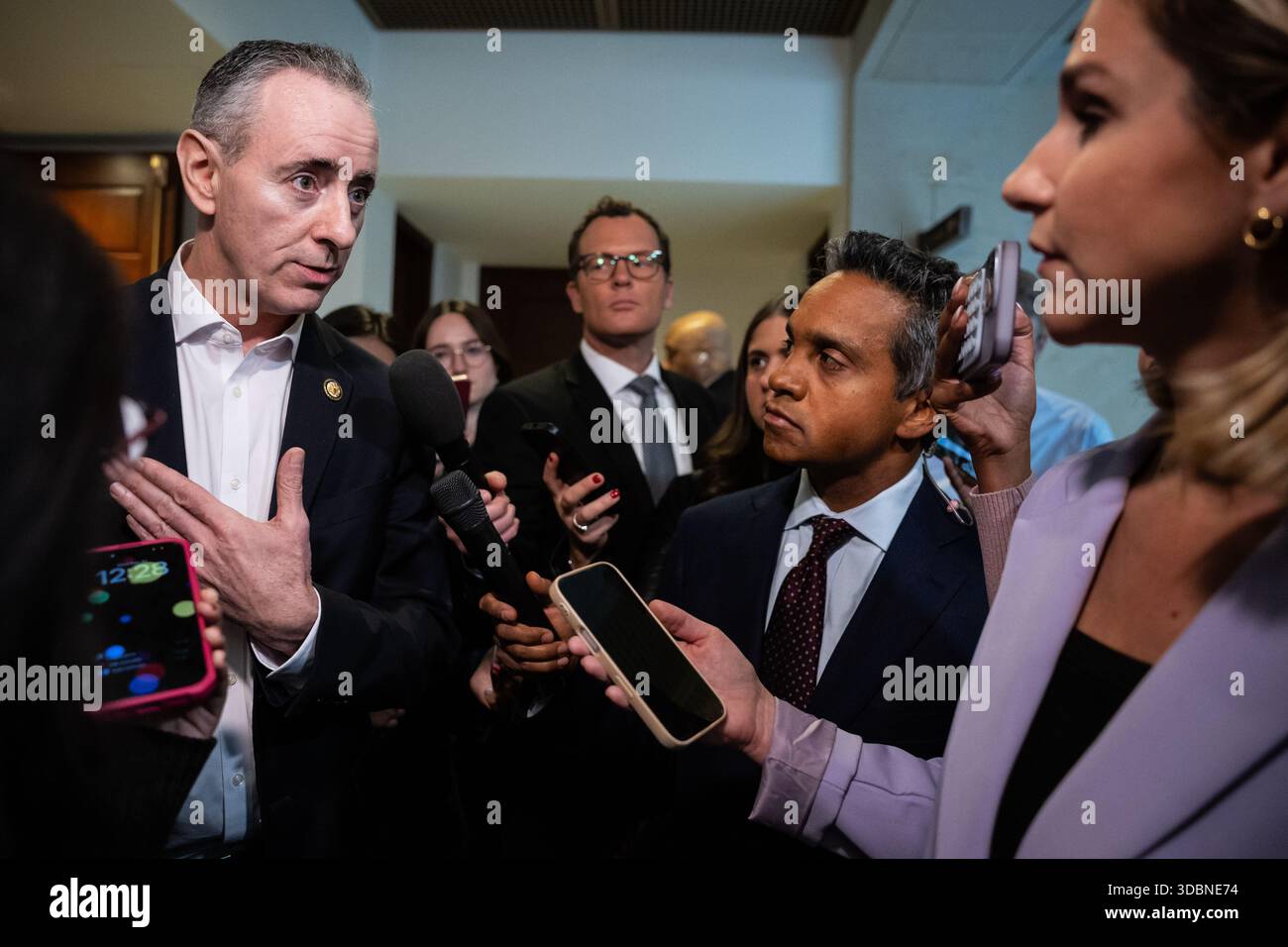 Rep. Brian Fitzpatrick (R-Pa.) speaks with reporters as he departs a ...