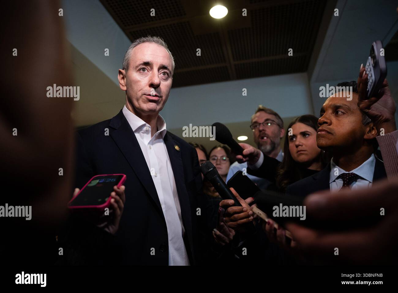 Rep. Brian Fitzpatrick (R-Pa.) speaks with reporters as he departs a ...