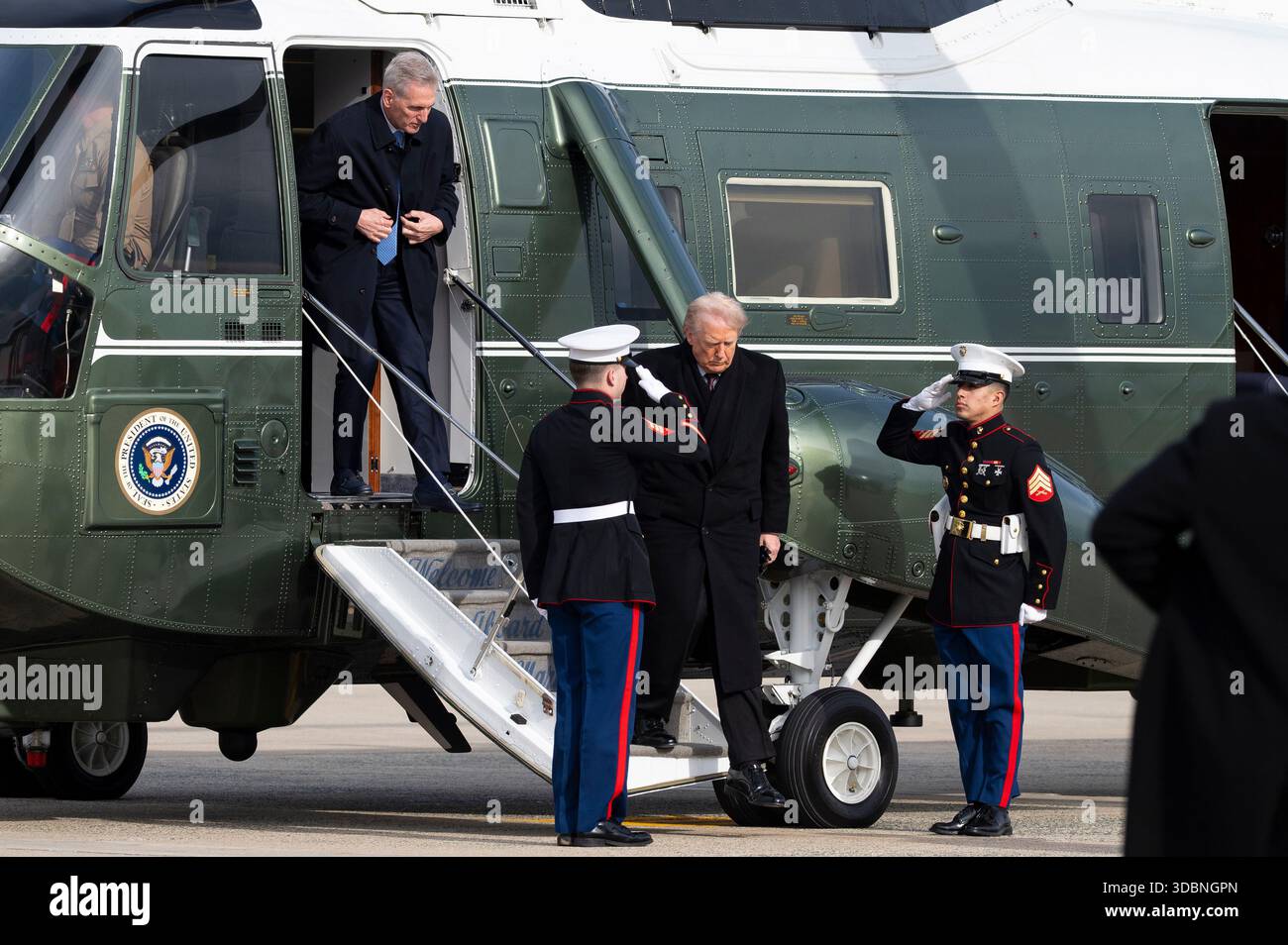 Former Speaker of the House Kevin McCarthy, left, follows President ...