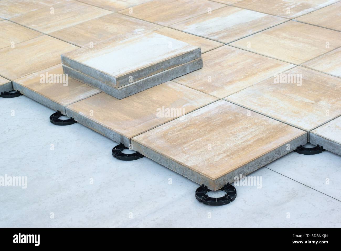 Exterior pavement tiles installation on the house terrace. External ...