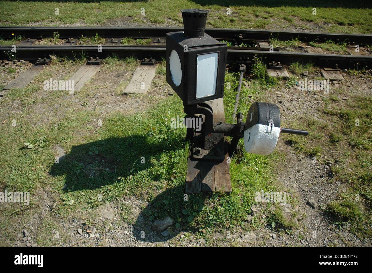 Manual railway switch lantern and signal beside narrow gauge track at ...