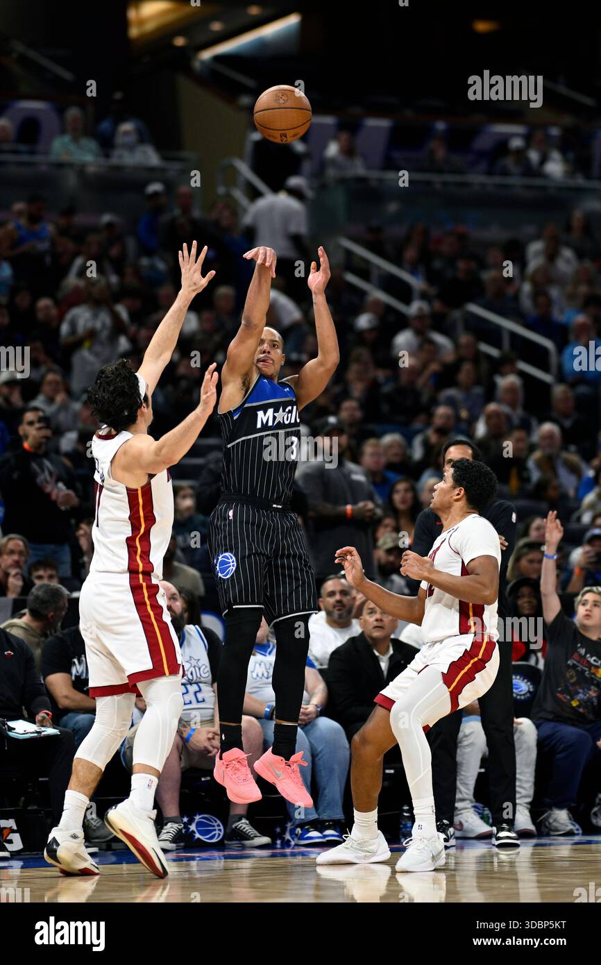 Orlando Magic guard Desmond Bane (3) shoots a 3-pointer between Miami ...