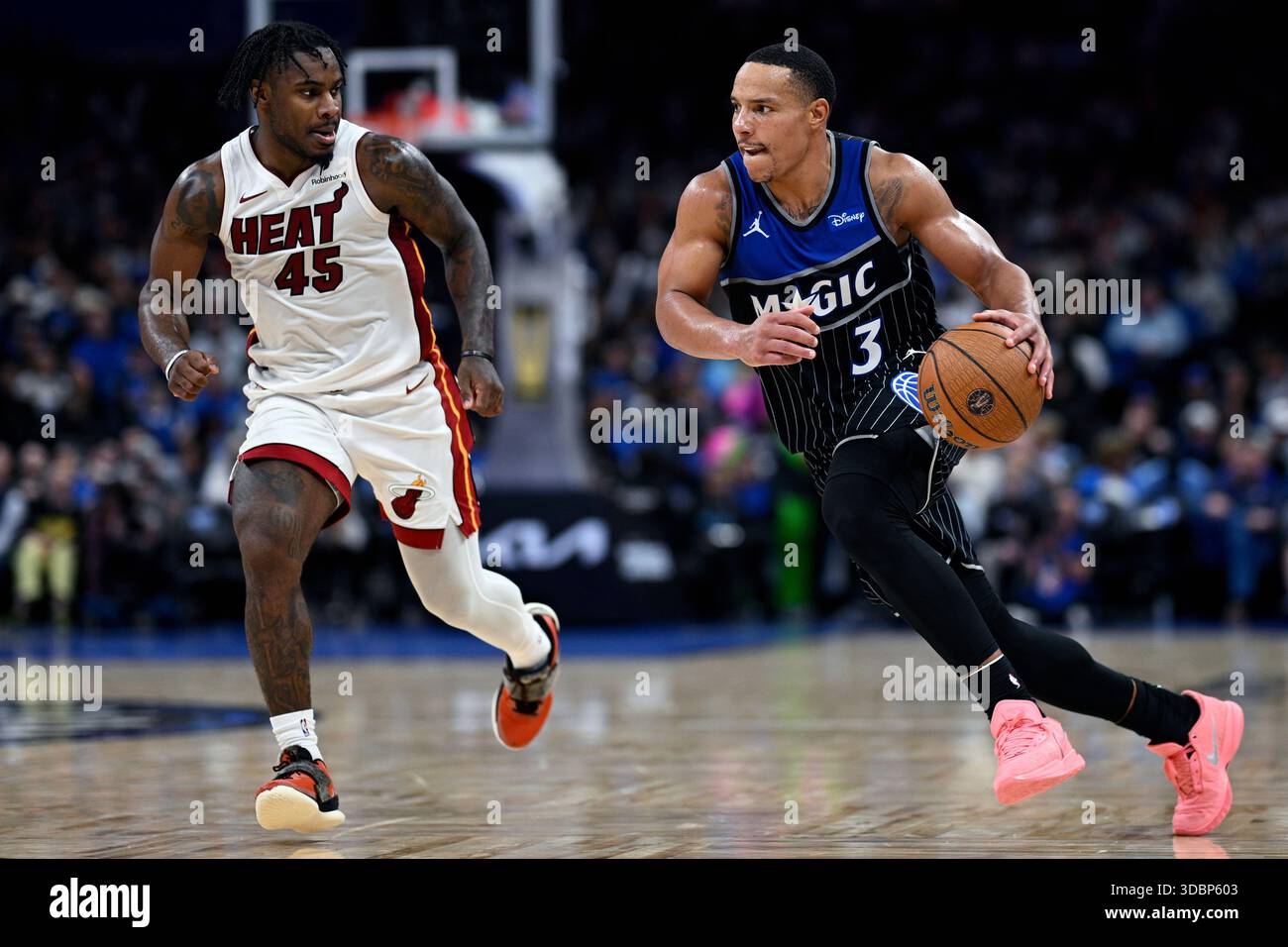 Orlando Magic guard Desmond Bane (3) is defended by Miami Heat guard Davion Mitchell (45) during ...