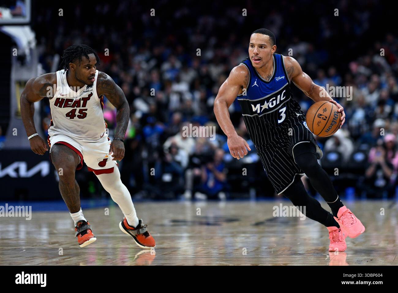 Orlando Magic guard Desmond Bane (3) is defended by Miami Heat guard ...