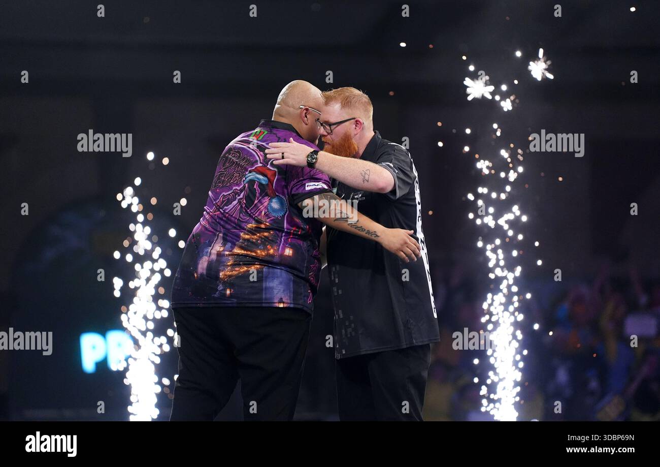 Adam Sevada (left) embraces Matt Campbell after winning their match on ...