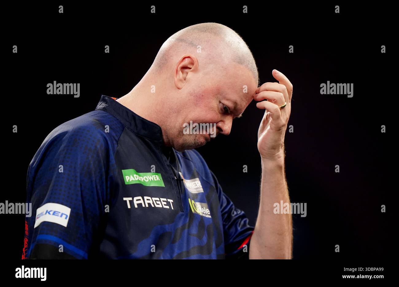 Raymond van Barneveld reacts during his match against Stefan Bellmont ...