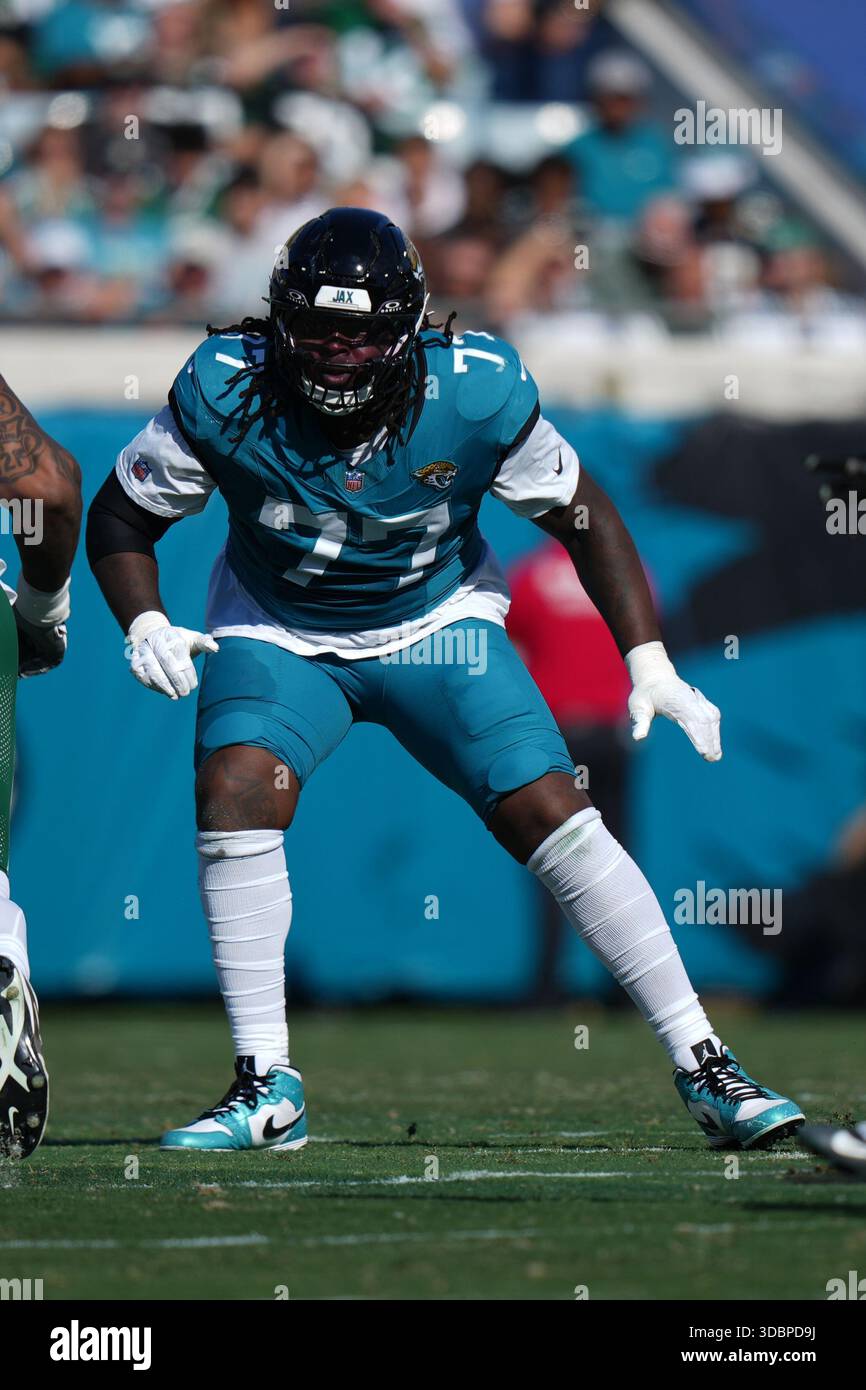 Jacksonville Jaguars offensive tackle Anton Harrison (77) protects thhe ...