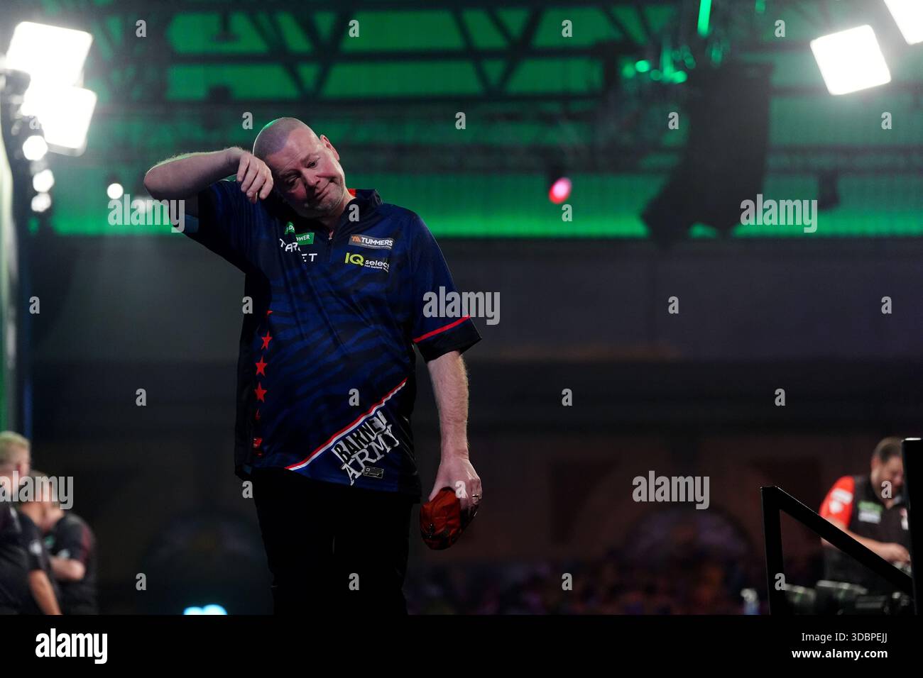 Raymond van Barneveld reacts as he leaves the stage after losing his ...
