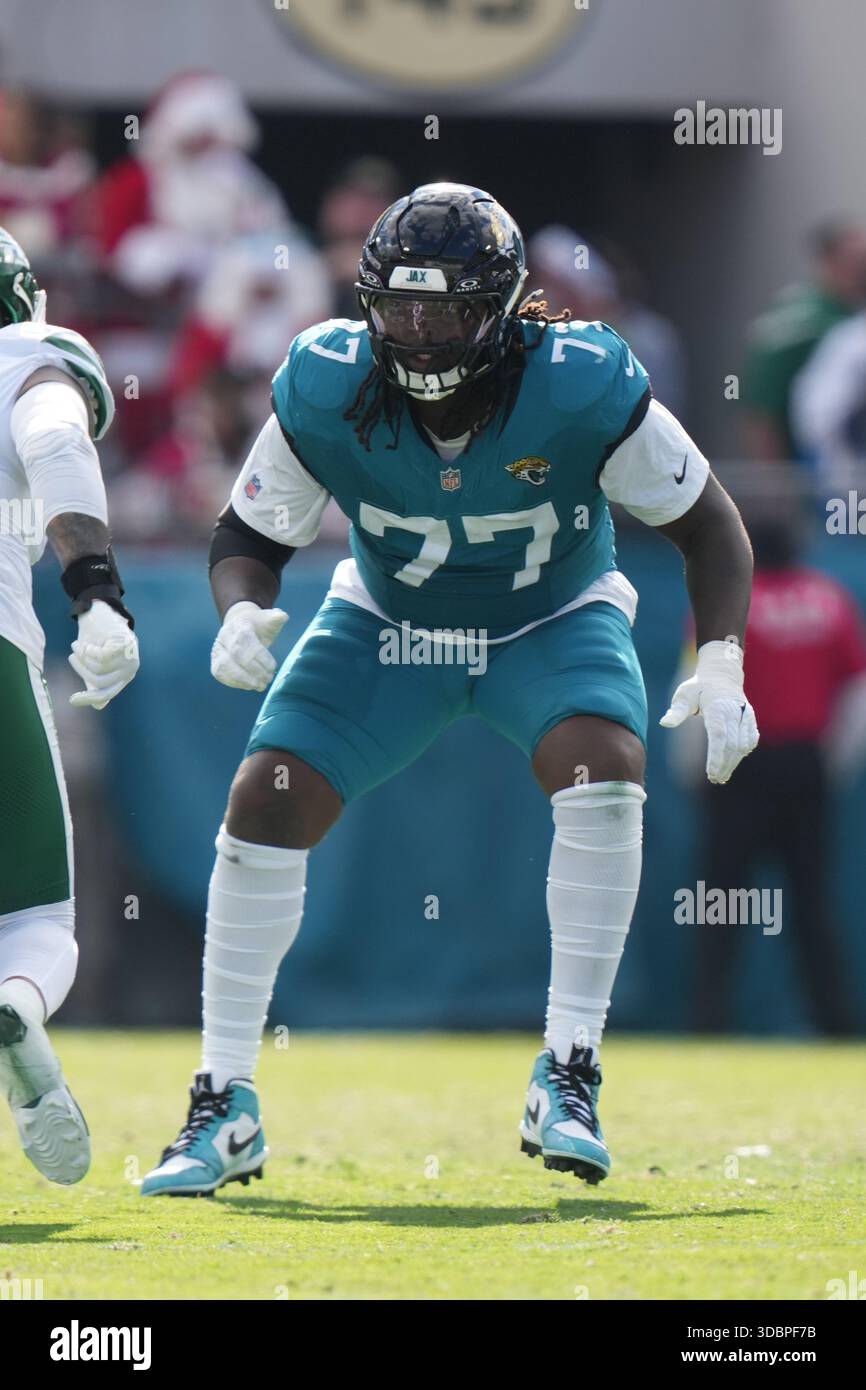Jacksonville Jaguars offensive tackle Anton Harrison (77) protecsts the ...