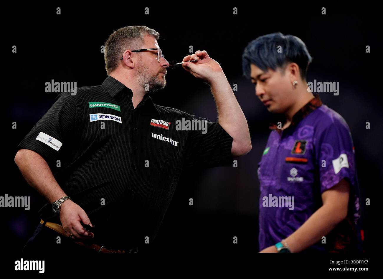 James Wade (left) during his match against Ryusei Azemoto on day seven ...
