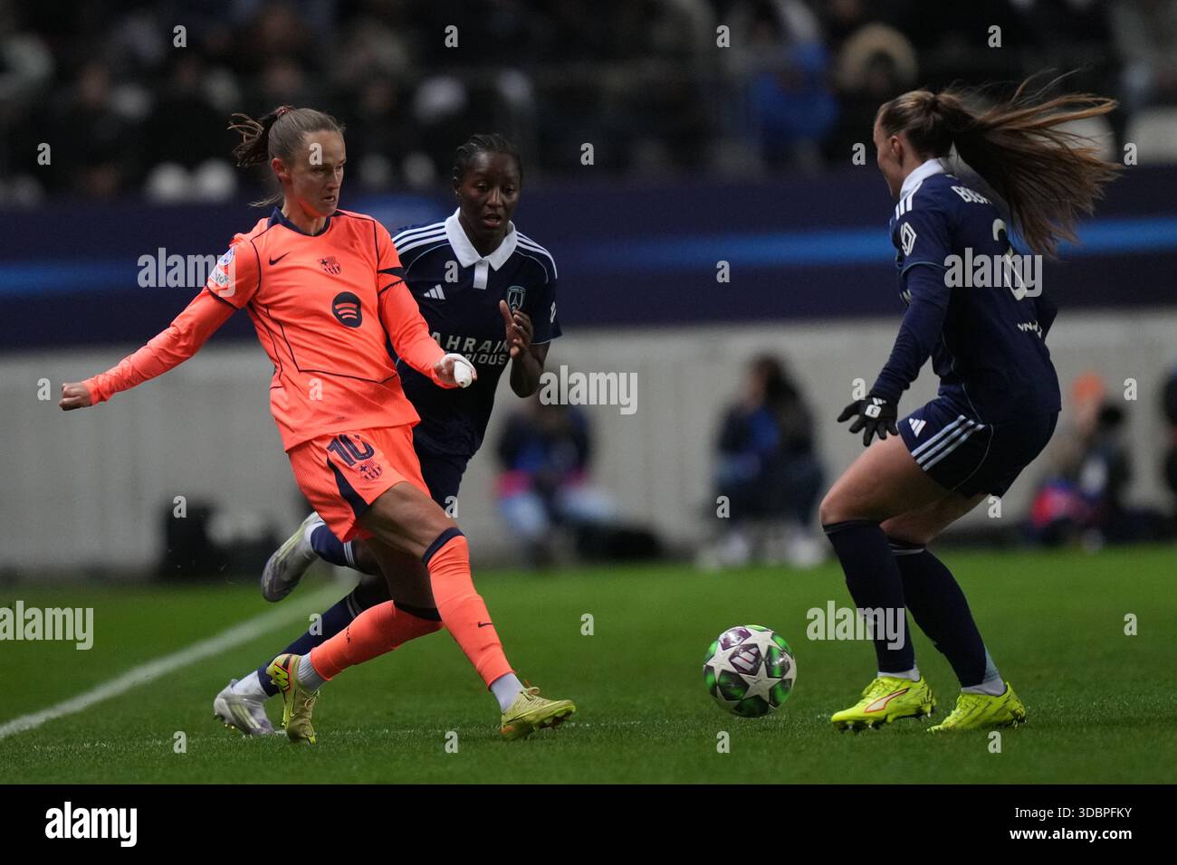 Barcelona's Caroline Graham Hansen passes the ball by Paris' Lou ...