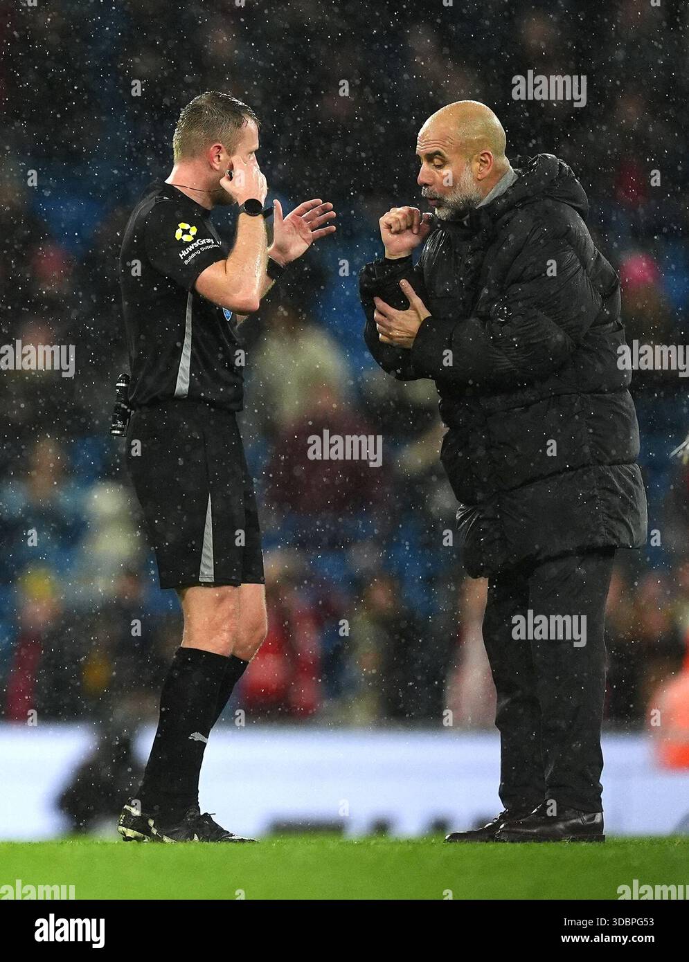 Manchester City manager Pep Guardiola (right) speaks with referee Sam ...