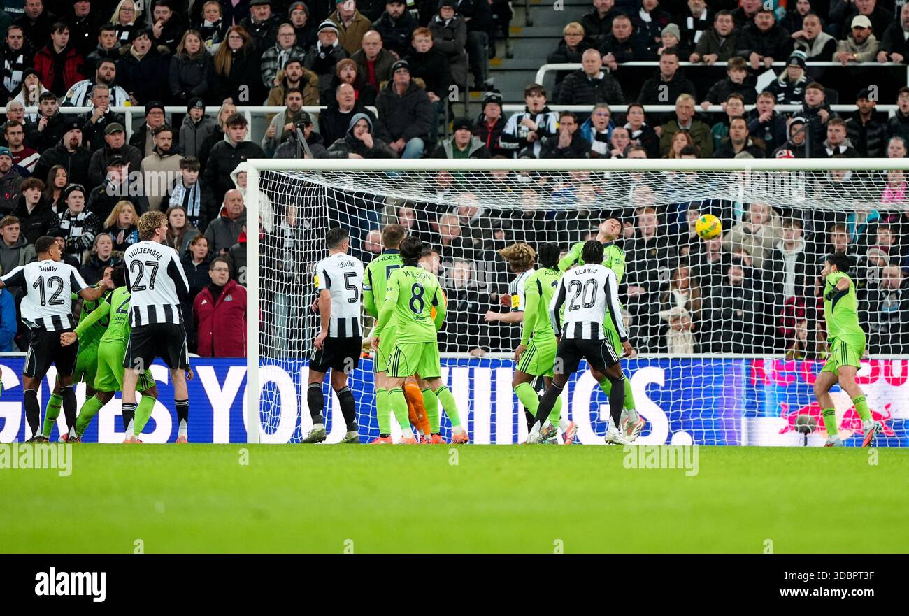 Newcastle United's Lewis Miley (obscured) scores his sides second goal ...