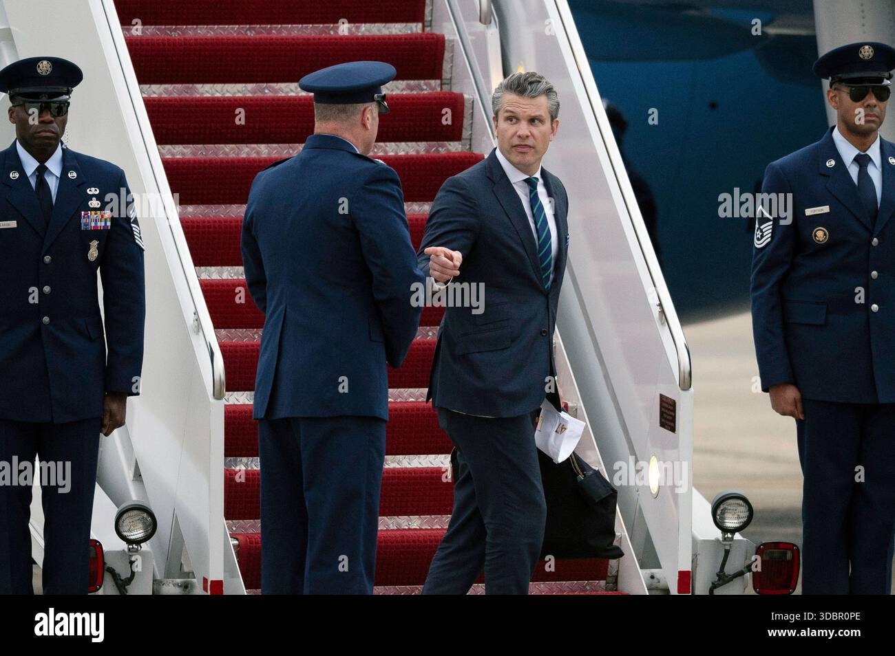 Defense Secretary Pete Hegseth gestures to Col. Christopher Robinson ...