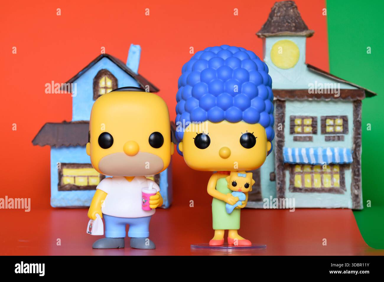 Funko Pop action figures of Homer and Marge with Maggie from animated ...