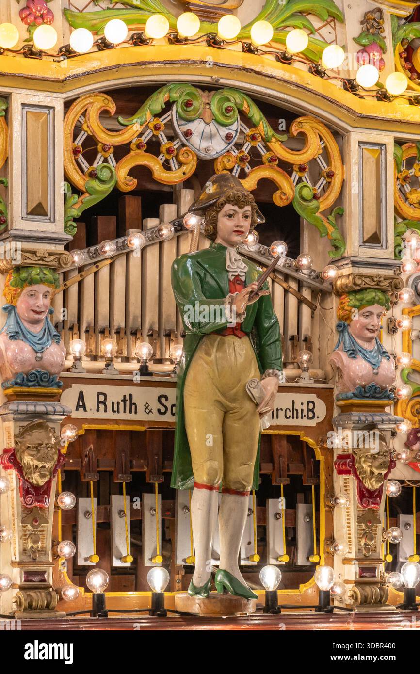 Close-up detail of a historic mechanical carousel organ, showing ...