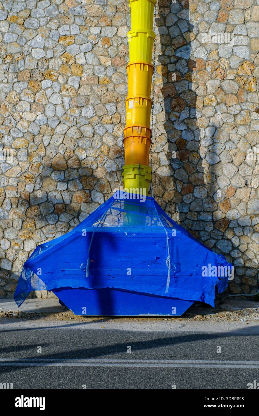 Construction waste removal into a skip container using long funnel ...