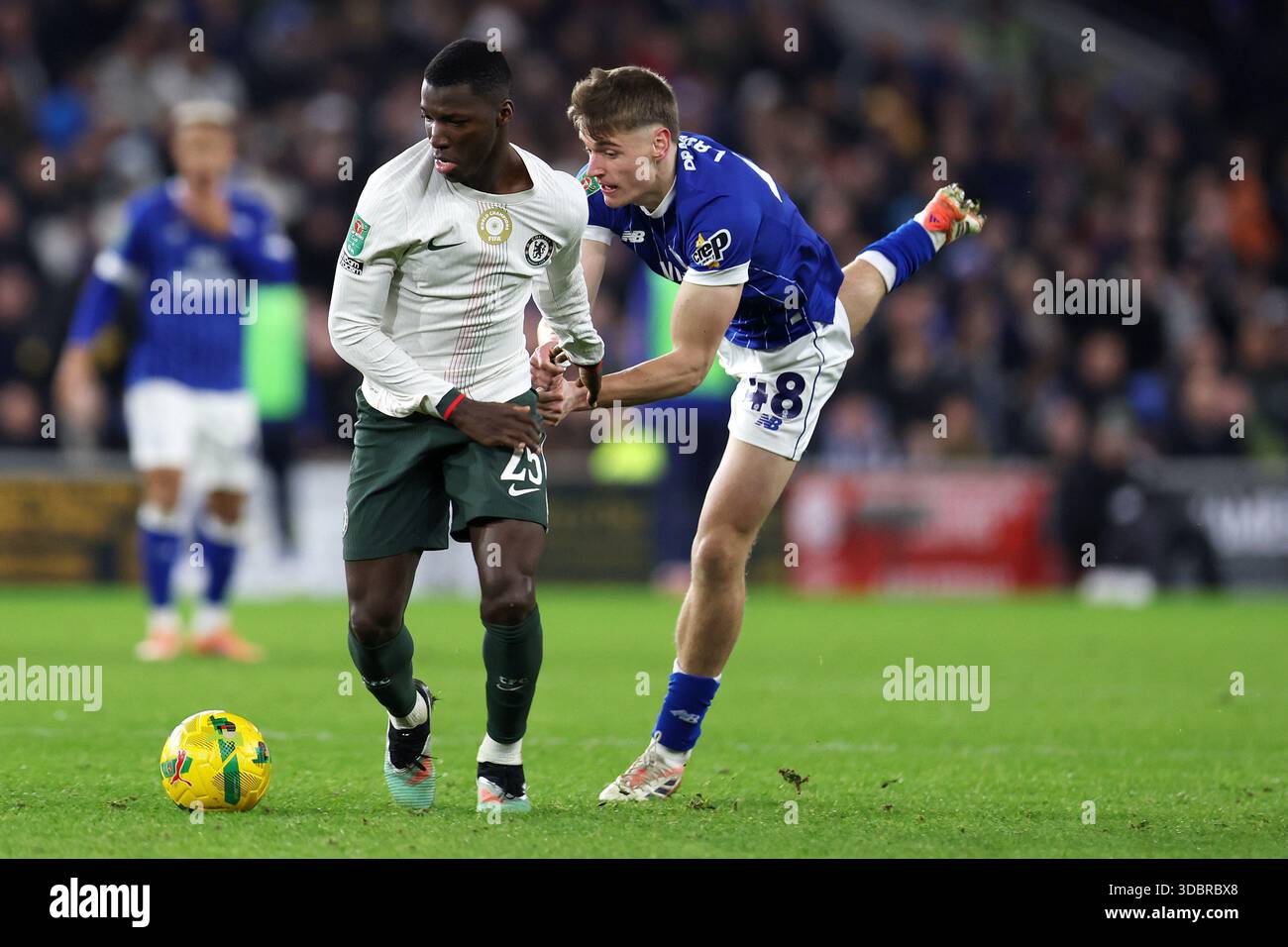 Moises Caicedo of Chelsea (l) breaks away from Dylan Lawlor of Cardiff City. Carabao Cup quarter ...