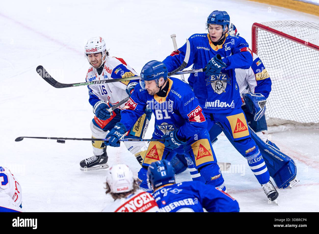 Sven Leuenberger #61 (EV Zug) and Santiago Naf #92 (EV Zug ...