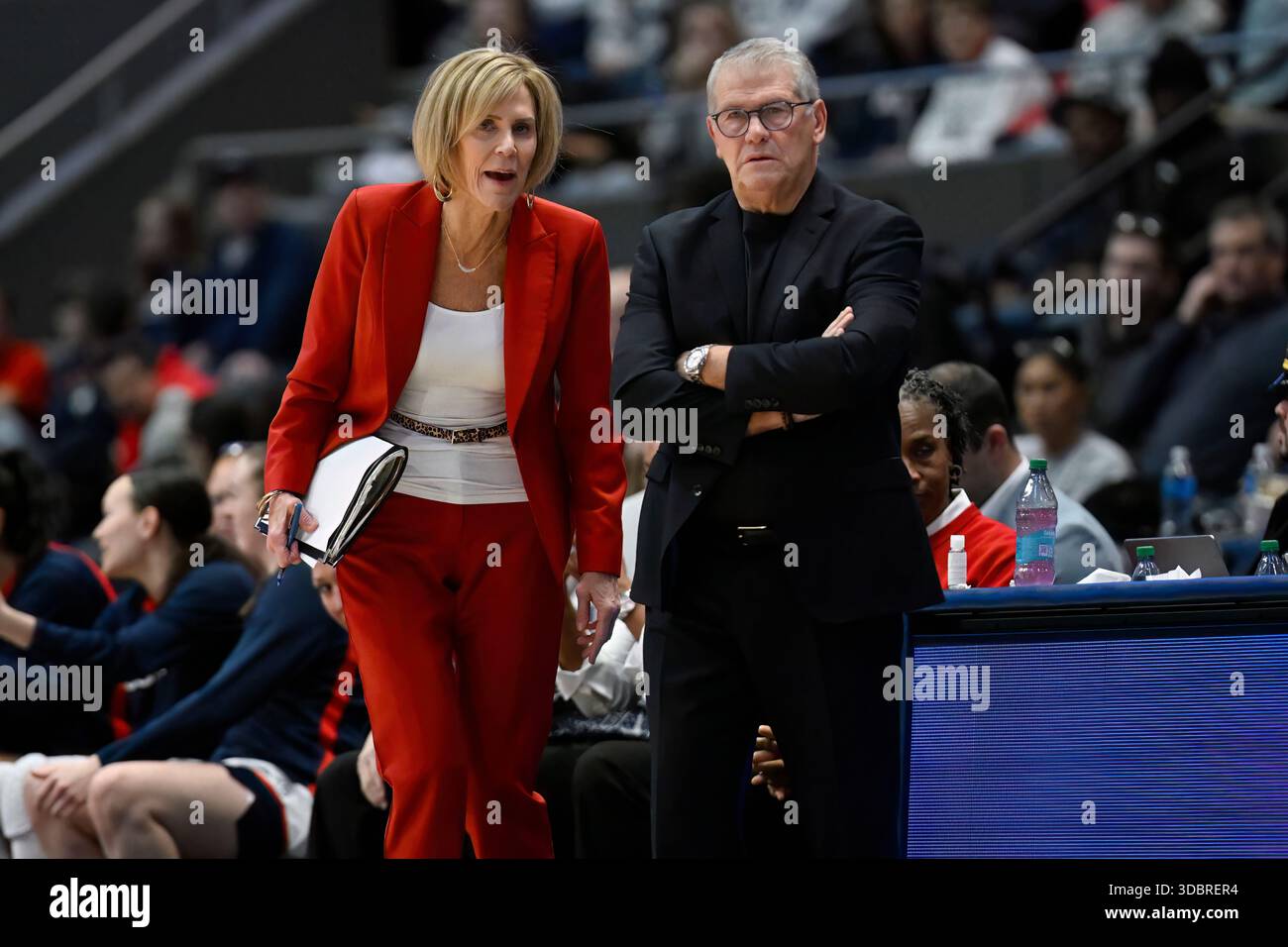 UConn associate head coach Chris Dailey, left, talks with head coach ...
