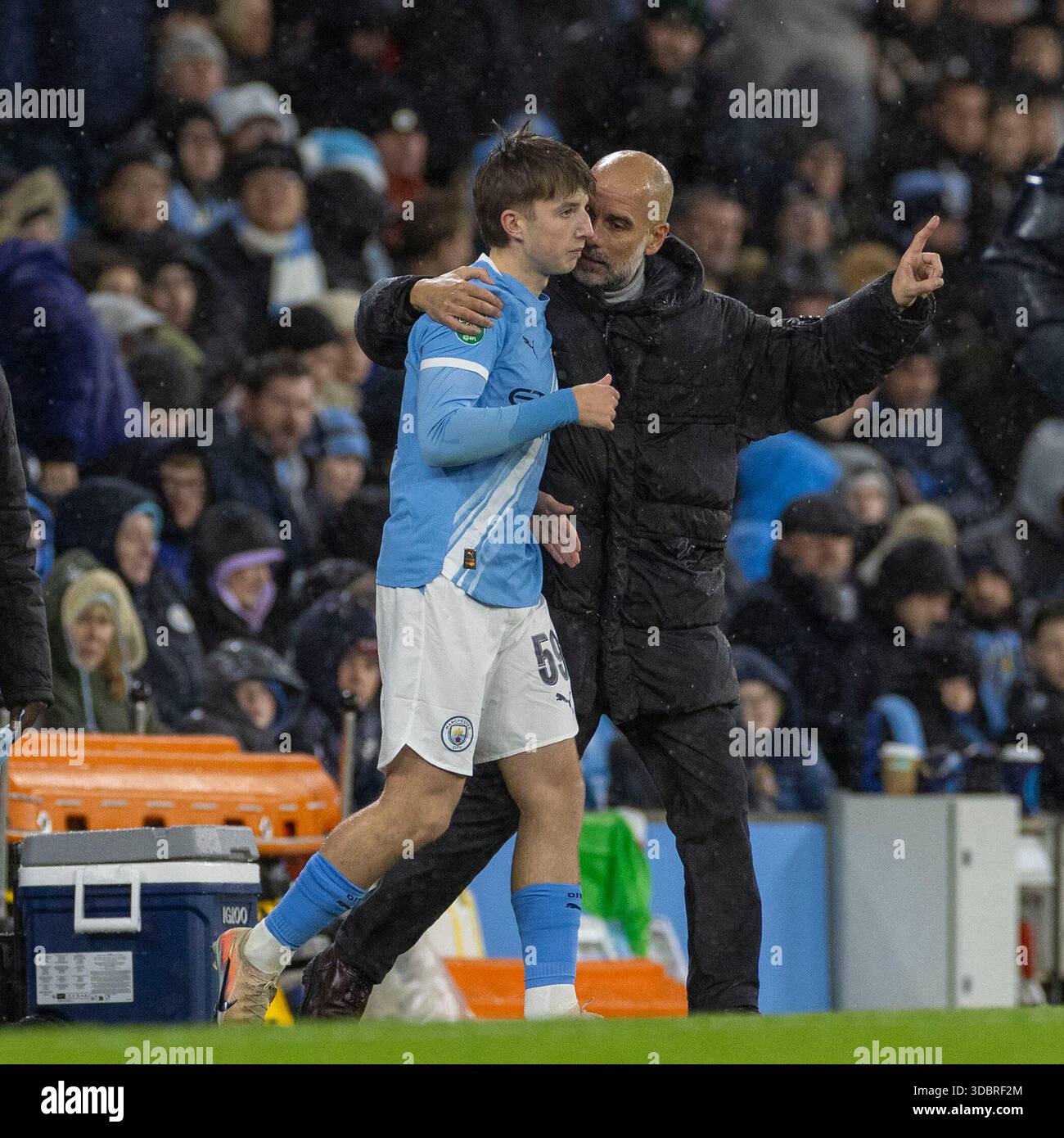 Manchester City F.C. manager Pep Guardiola give instruction to Charlie ...
