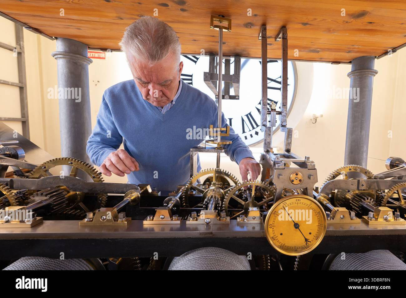 Clockmaker Jesús López-Terradas stands next to the clock at the Puerta ...