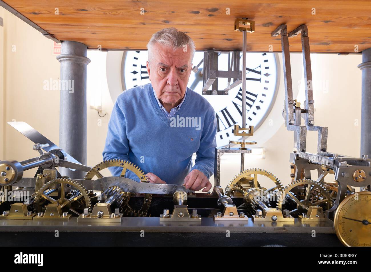 Clockmaker Jesús López-Terradas stands next to the clock at the Puerta ...