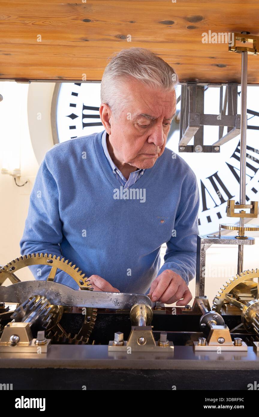 Clockmaker Jesús López-Terradas stands next to the clock at the Puerta ...