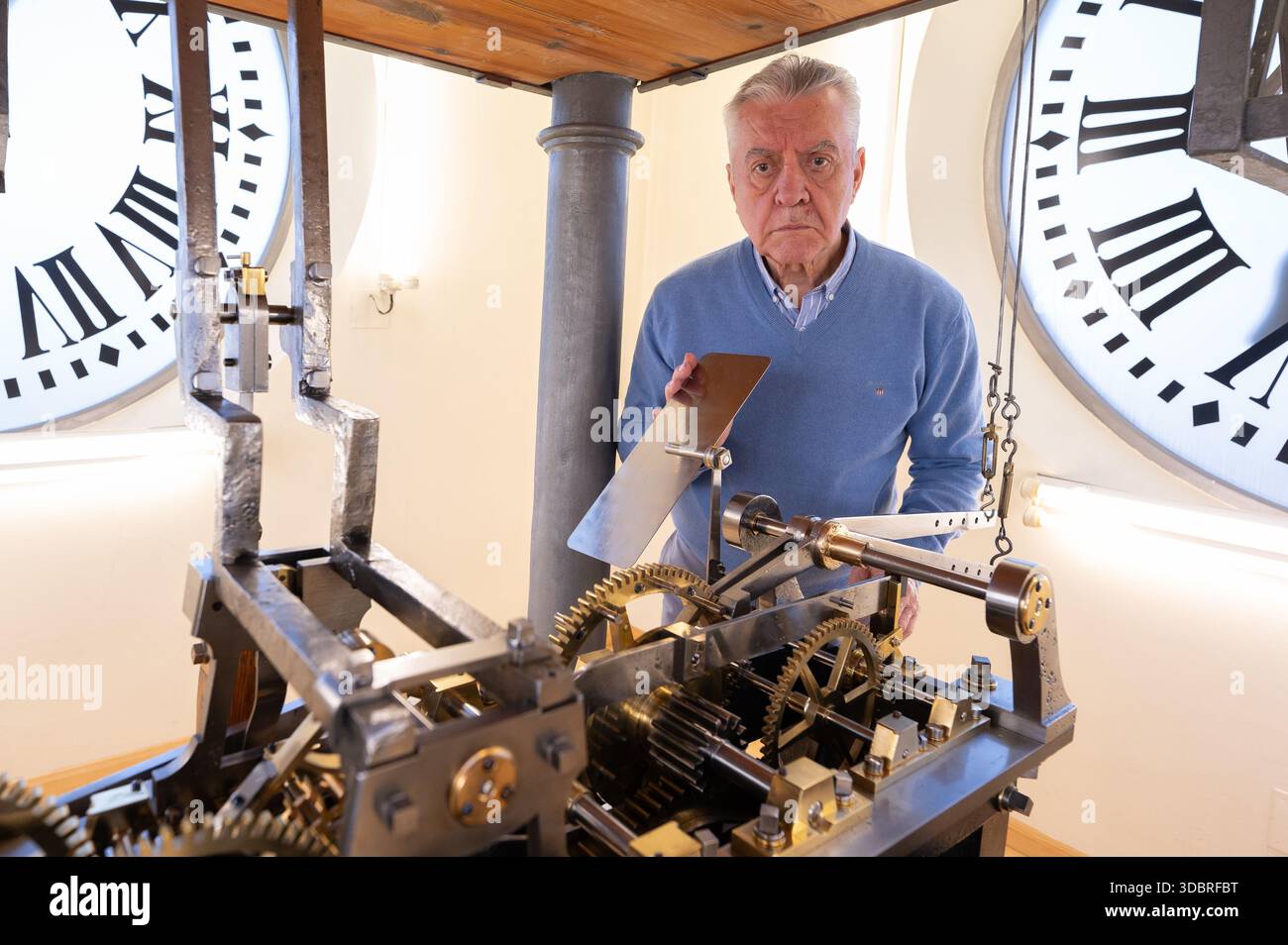 Clockmaker Jesús López-Terradas stands next to the clock at the Puerta ...