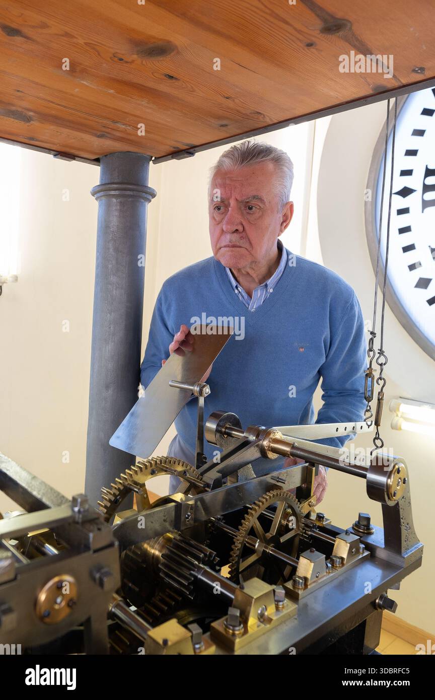 Clockmaker Jesús López-Terradas stands next to the clock at the Puerta ...