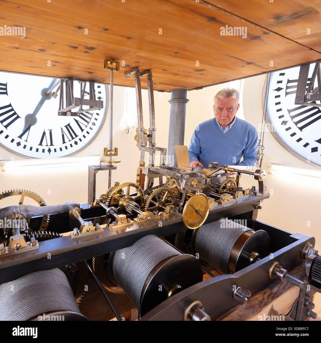 Clockmaker Jesús López-Terradas stands next to the clock at the Puerta ...