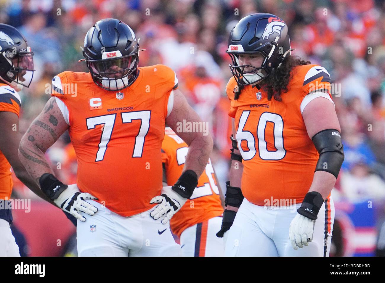 Denver Broncos guard Quinn Meinerz (77) and Denver Broncos center Luke ...