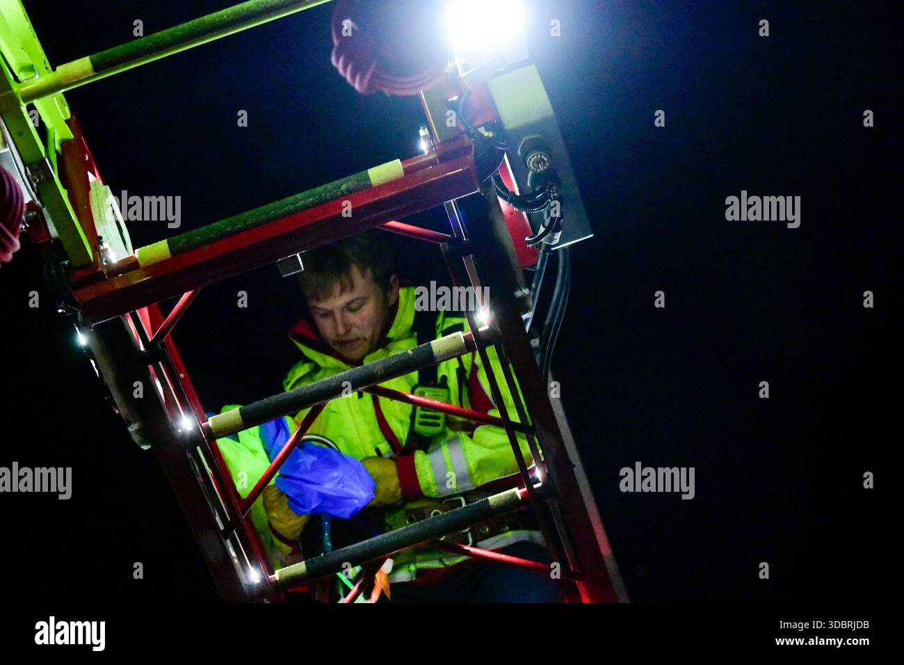 Menachem Mendel, of Brooklyn, N.Y., adjusts a light-up menorah as the ...