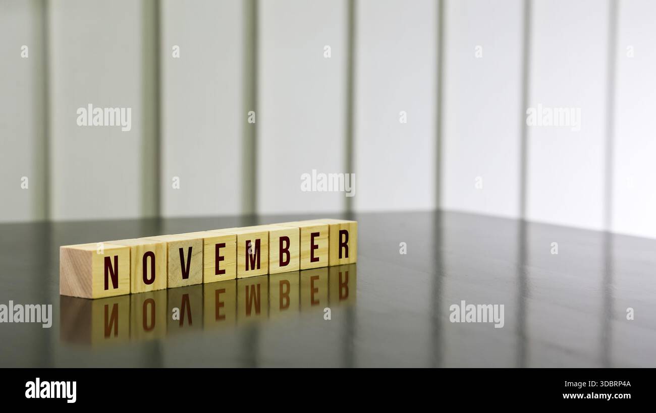 November Month Concept with Wooden Letter Blocks on Minimal Table Stock ...
