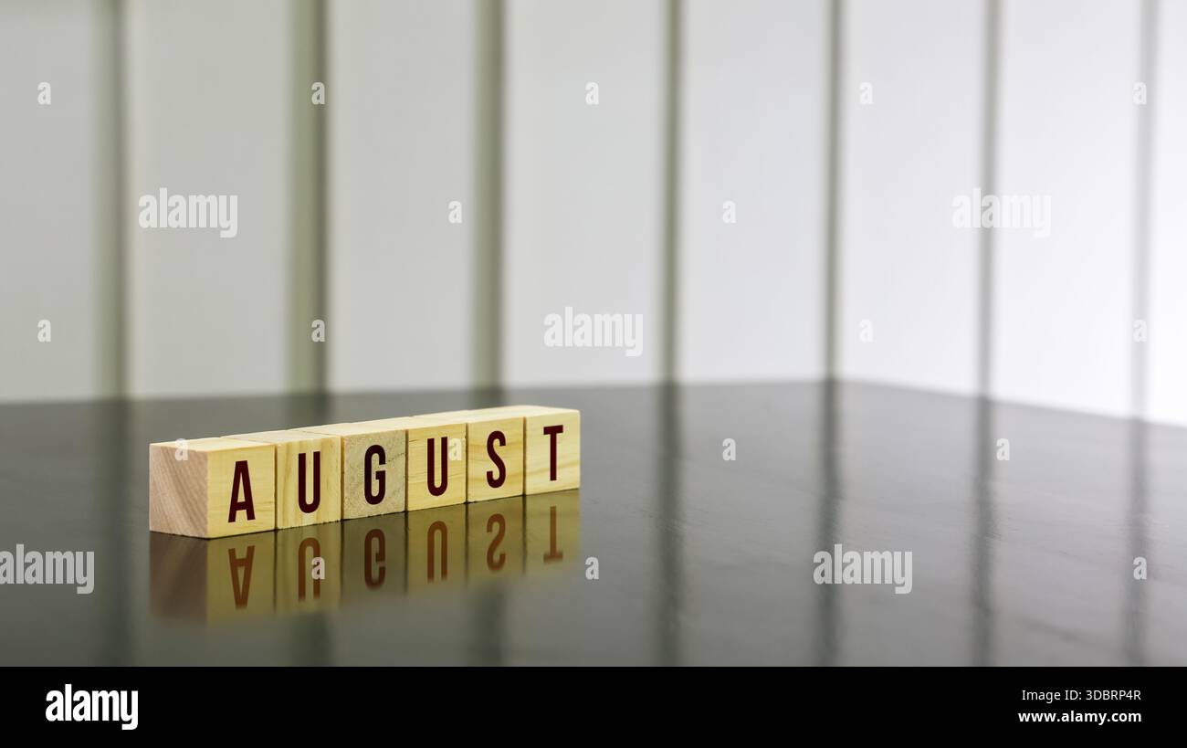 August Month Concept with Wooden Letter Blocks on Minimal Table Stock ...