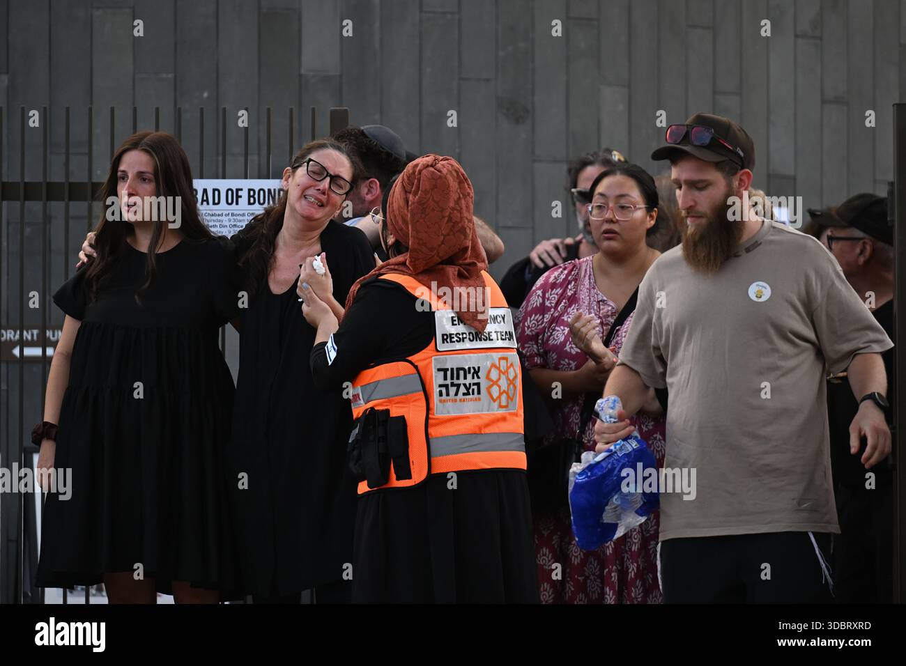 Emotional family and friends mourn as the casket of Tibor Weitzen is ...