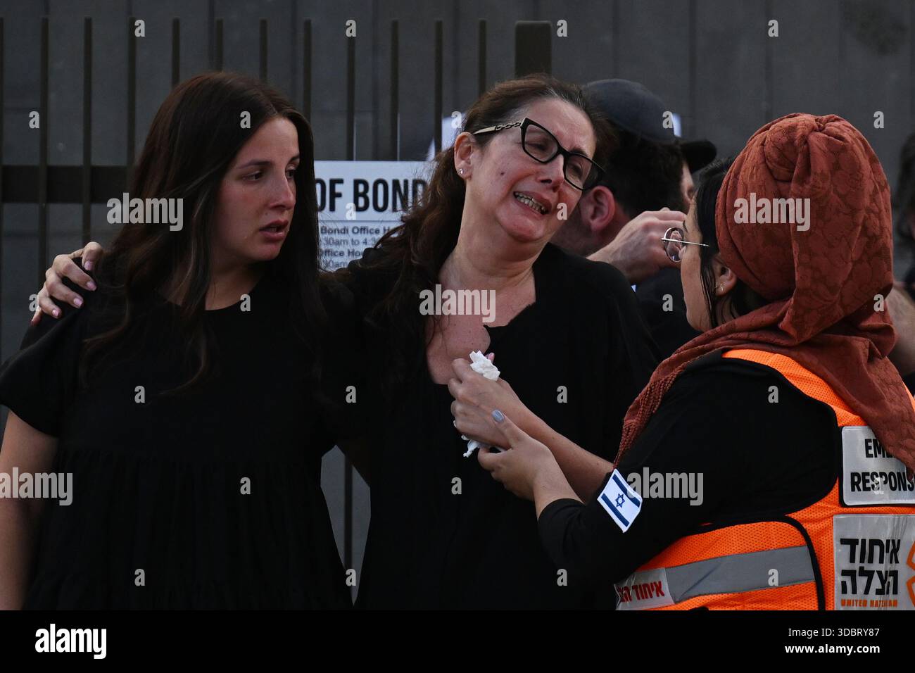 Emotional family and friends mourn as the casket of Tibor Weitzen is ...