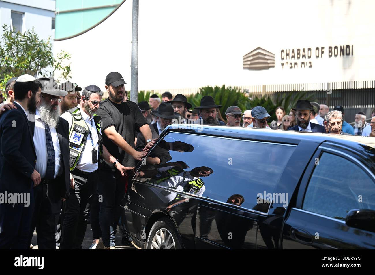 Emotional family and friends mourn as the casket of Tibor Weitzen is ...