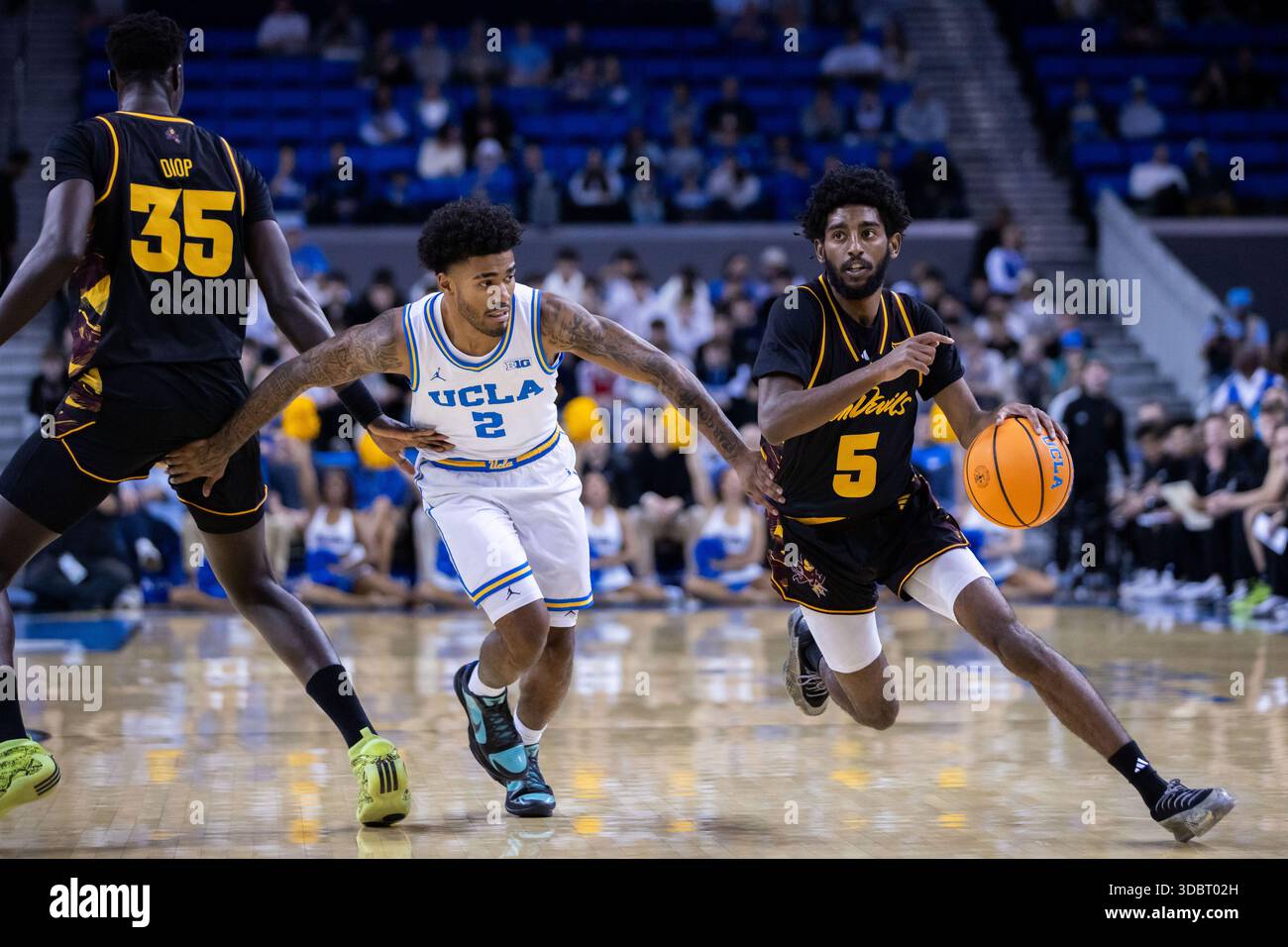 Arizona State guard Maurice Odum (5) drives the ball against UCLA guard ...