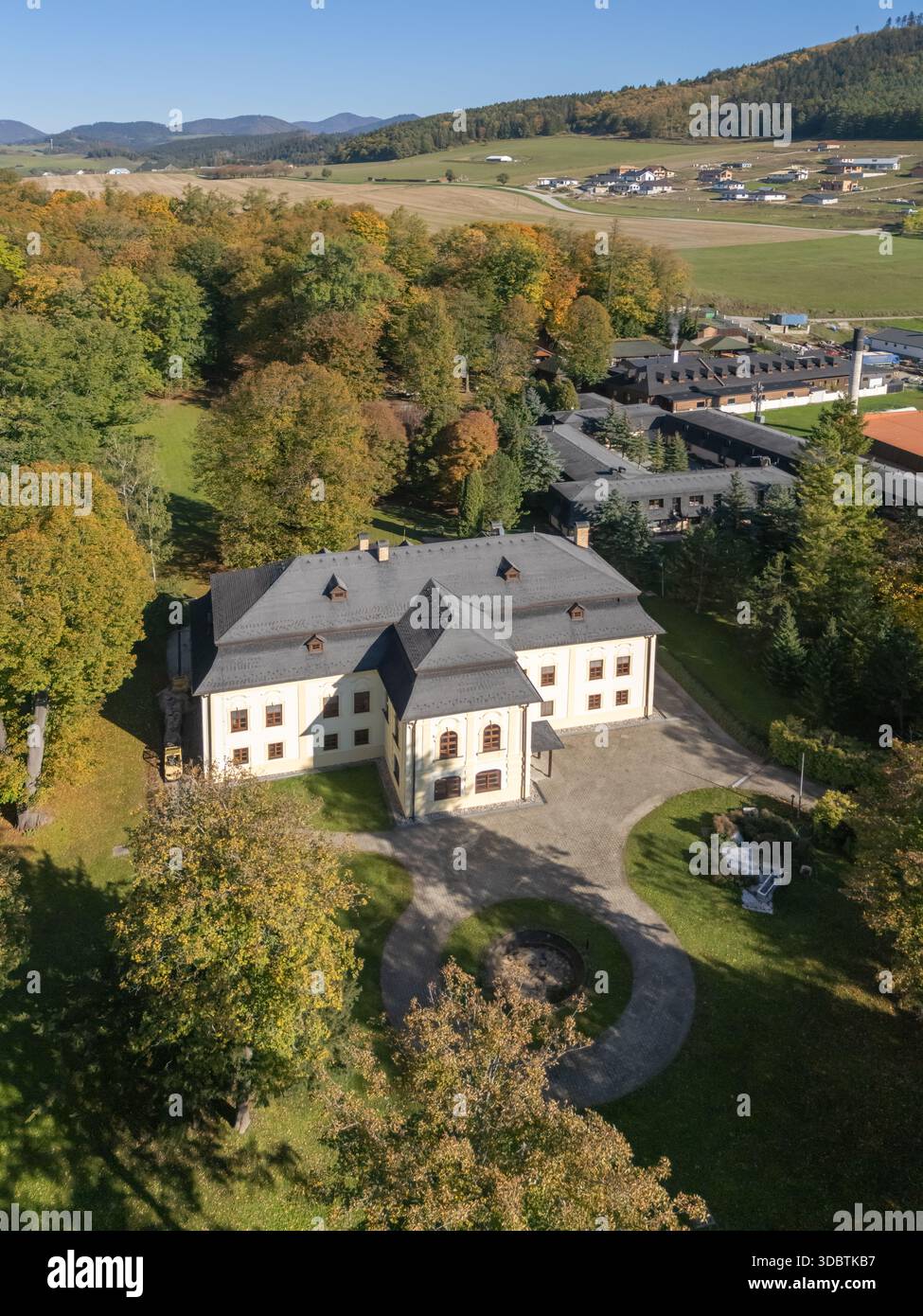 Aerial view of Dolny Kastiel standing proud amidst the vibrant autumn ...