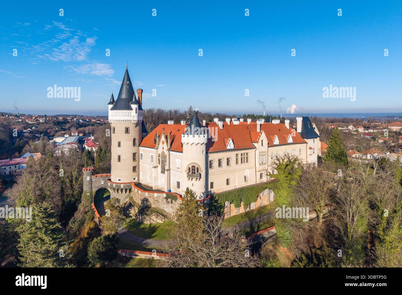 Zleby Castle stands tall in the landscape. This aerial view shows the ...