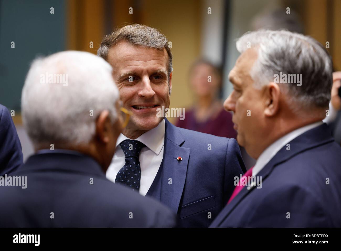 French President Emmanuel Macron, center, speaks with Hungary's Prime ...