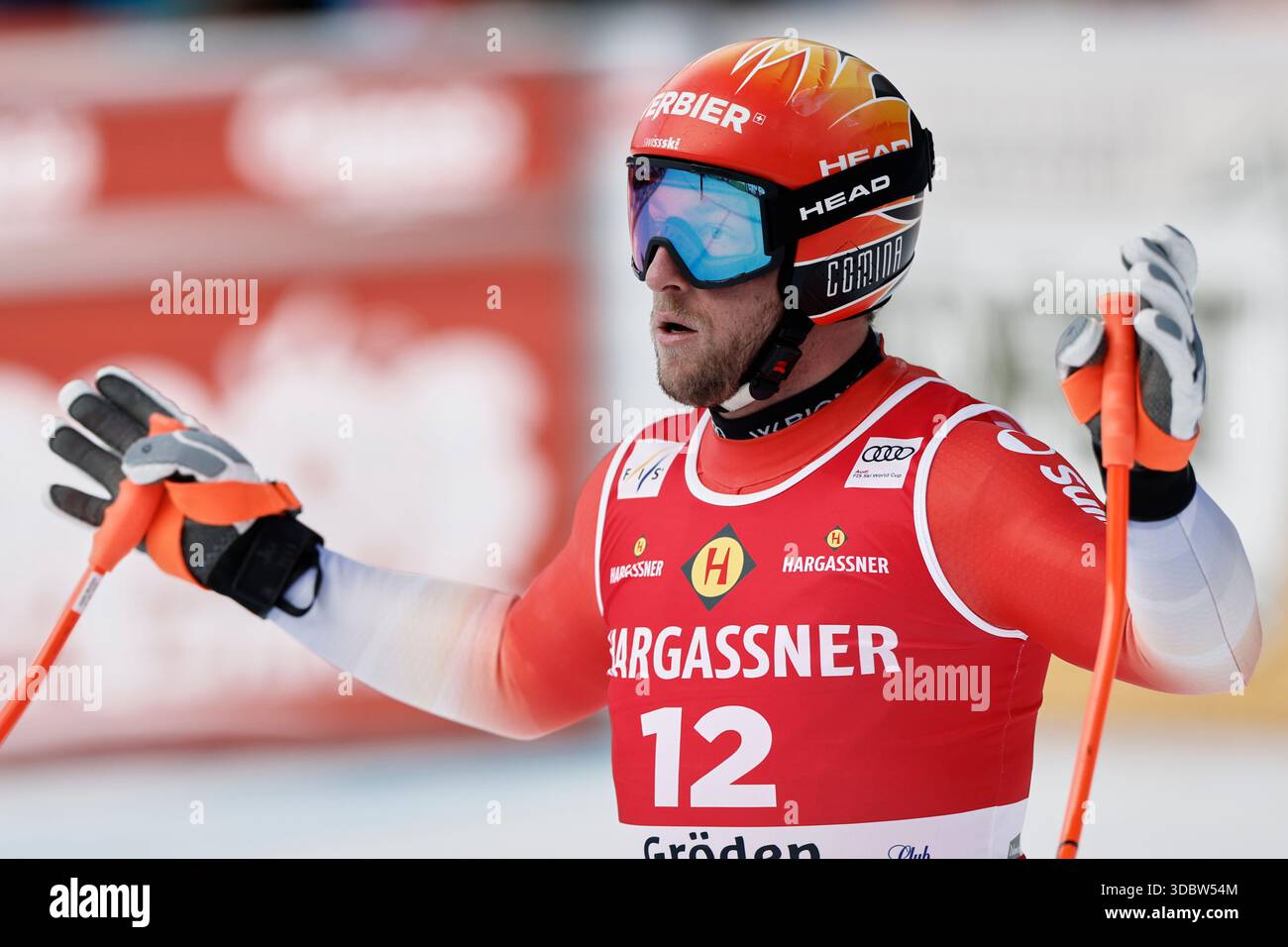 Switzerland's Justin Murisier reacts at the finish area of an alpine ...
